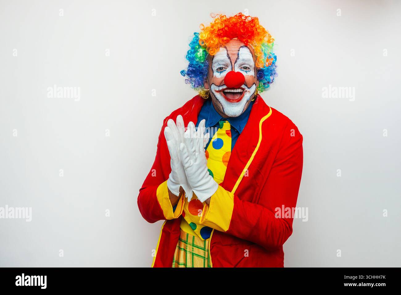 Cheerful clown clapping hands with joy Stock Photo - Alamy