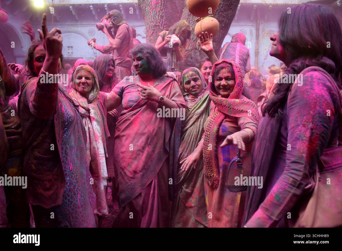 Joyful Indian women play Holi during the festival of colours in Vrindavan, Mathura, India Stock ...