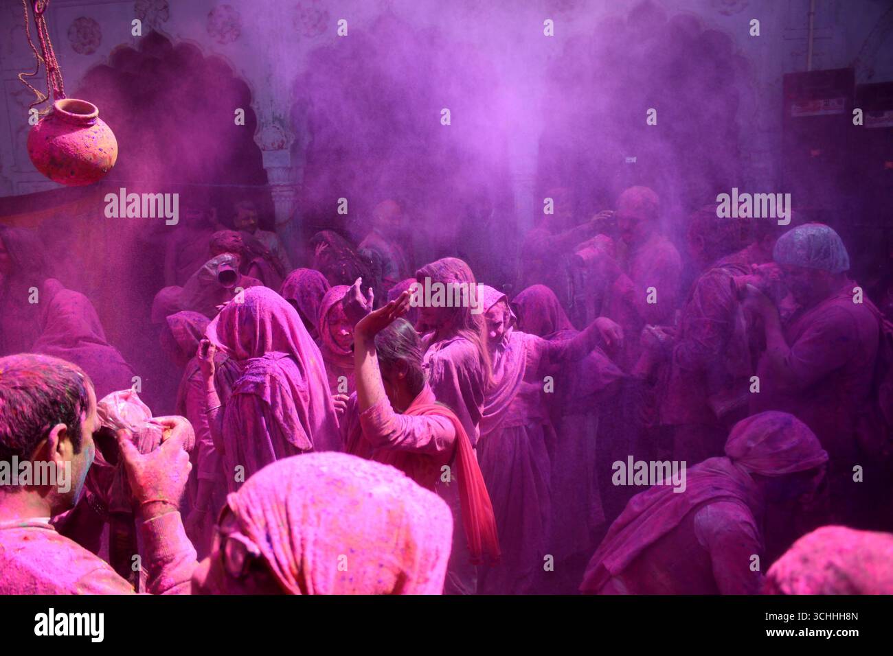 The atmosphere is filled with the colours of Holi, a Hindu festival, in Vrindavan, Mathura ...