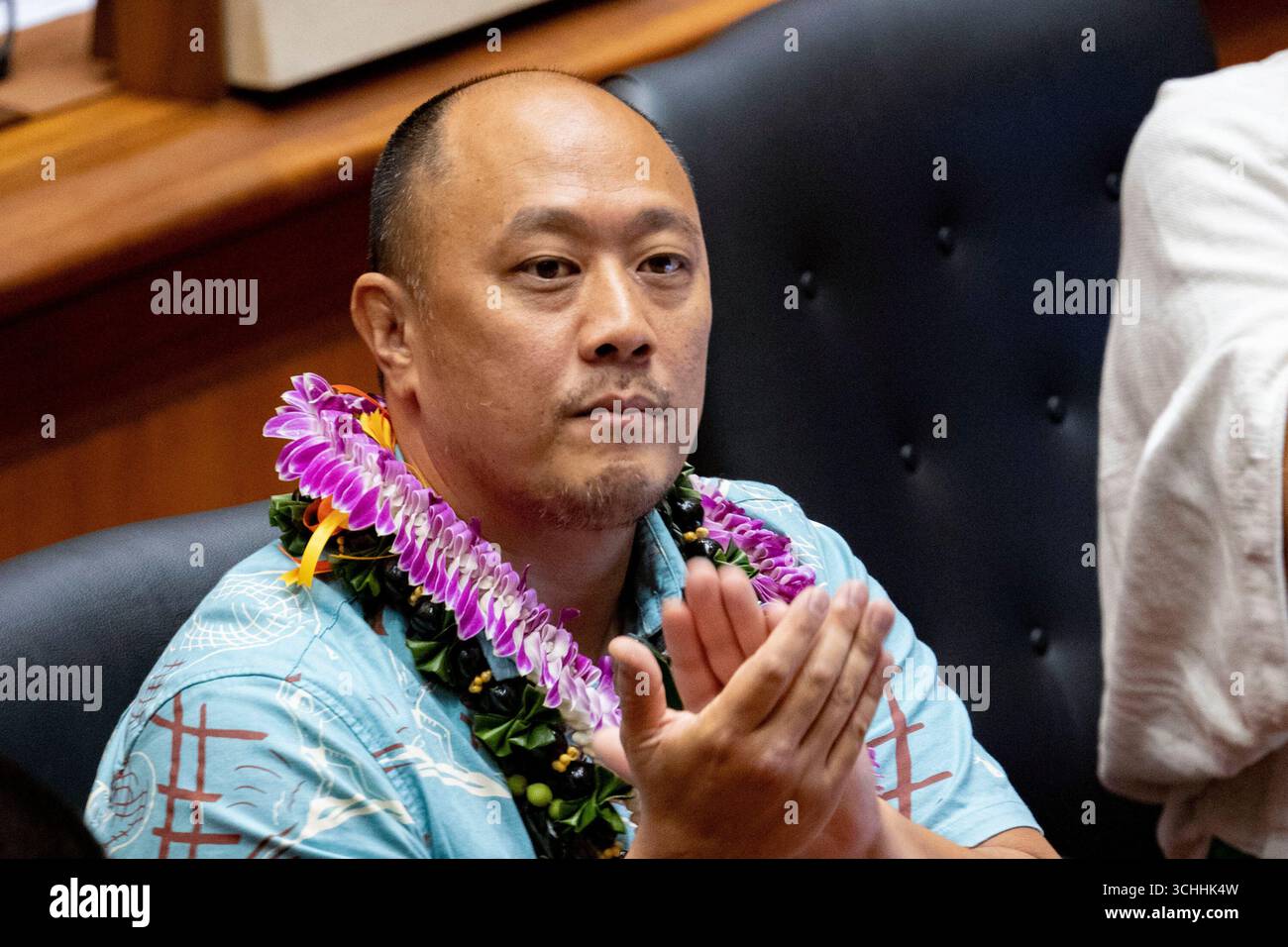 State Rep. Mike Lee, D-Kailua, claps after a speech at the state ...
