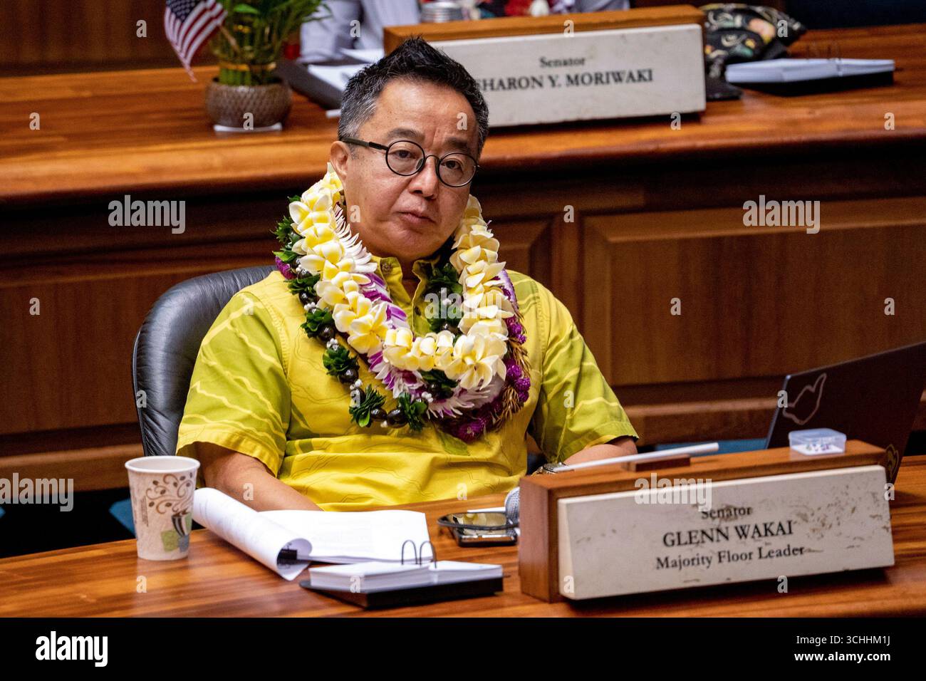 State Sen. Glenn Wakai listens during a floor session at the state ...