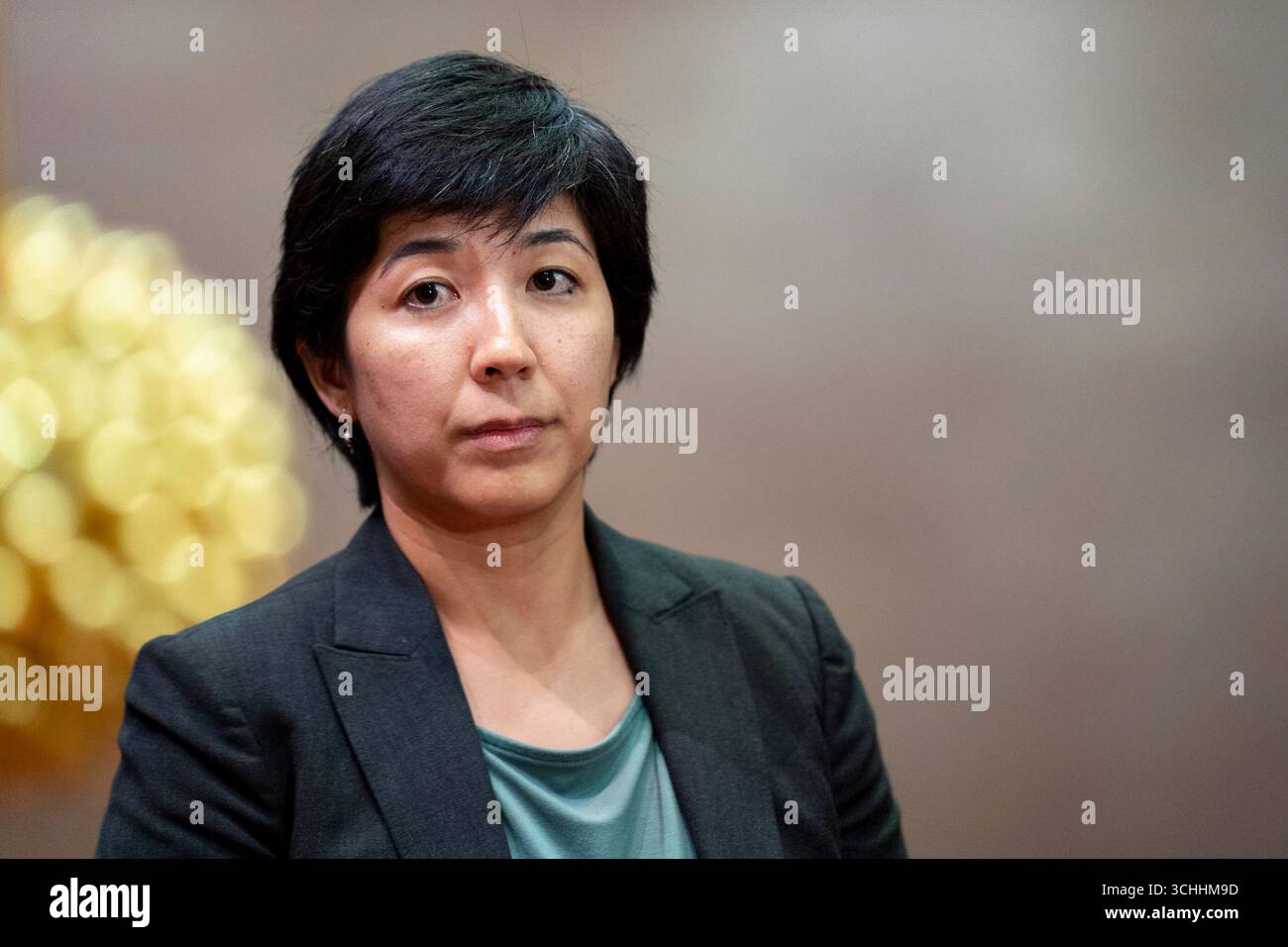 State Rep. Linda Ichiyama listens during a press conference at the ...