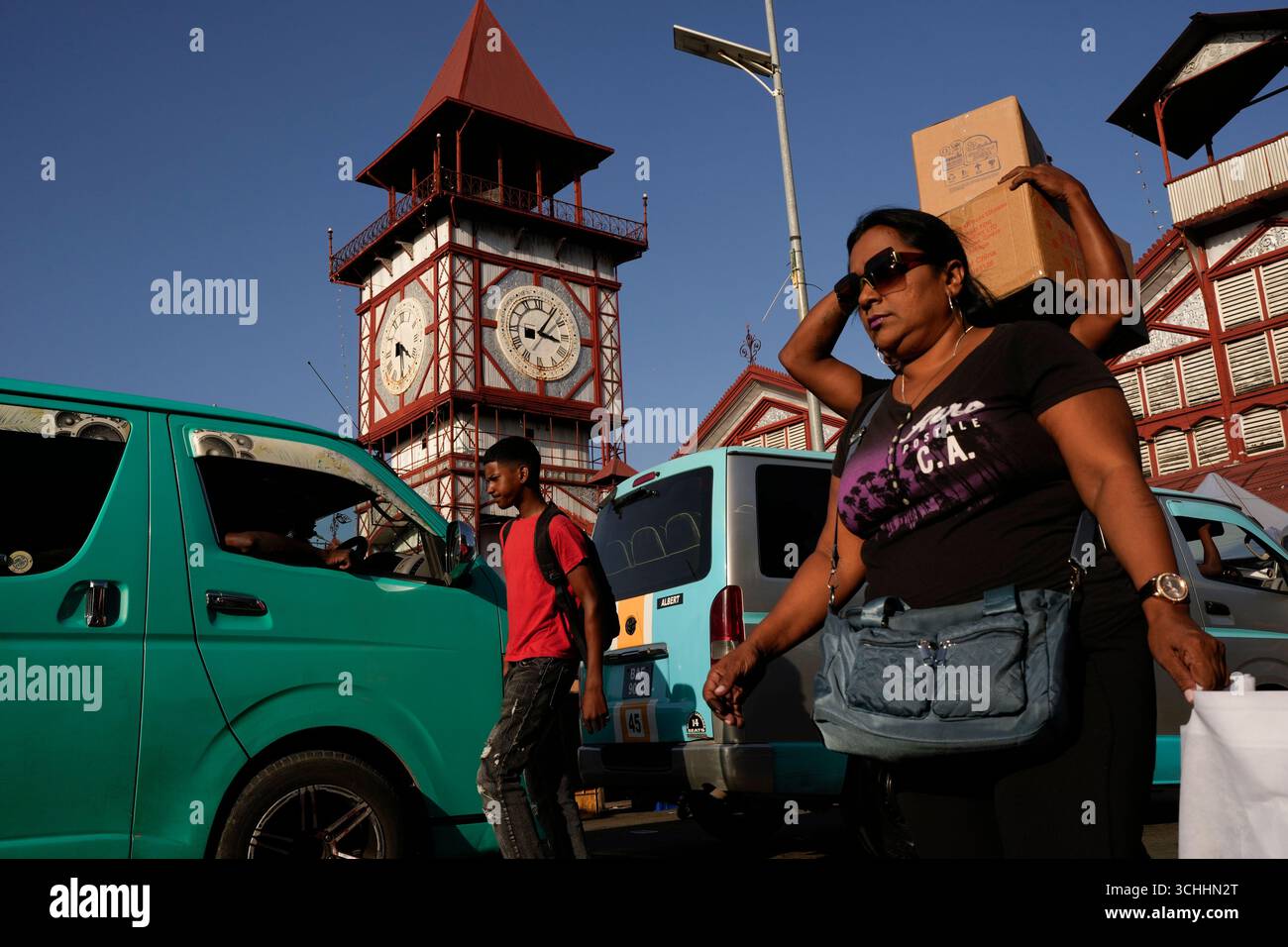 People walk through the Stabroek Market in Georgetown, Guyana, Tuesday ...