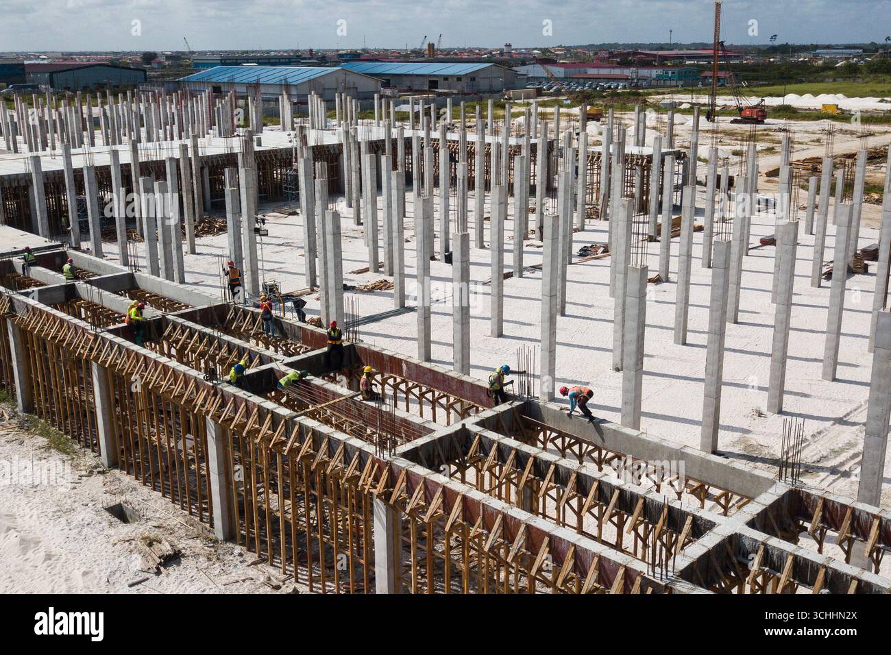 Construction workers labor on a new building in Georgetown, Guyana ...