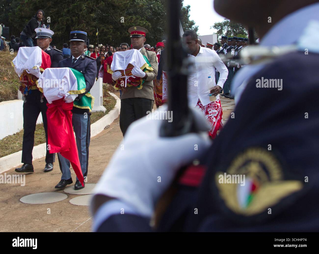 Security servicemen carry the three Sakalava skulls Tuesday, Sept. 2 ...