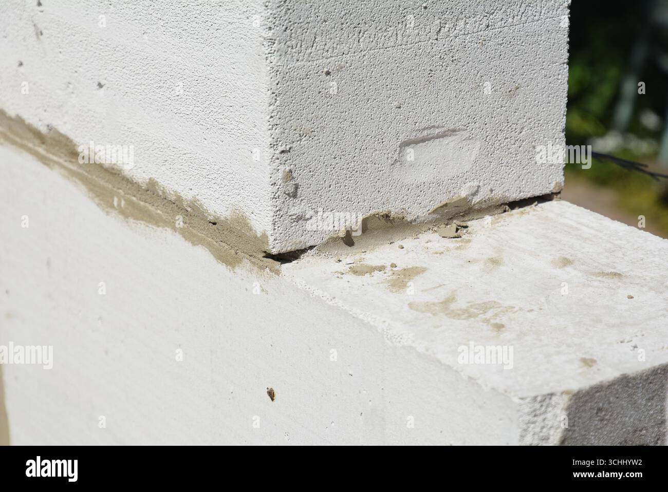 Laying autoclaved aerated concrete blocks for house wall. Close up on ...