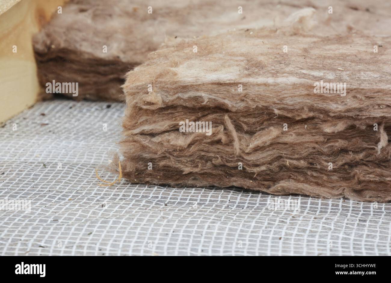 Roof Insulation. Close up on insulation layers of mineral wool ...