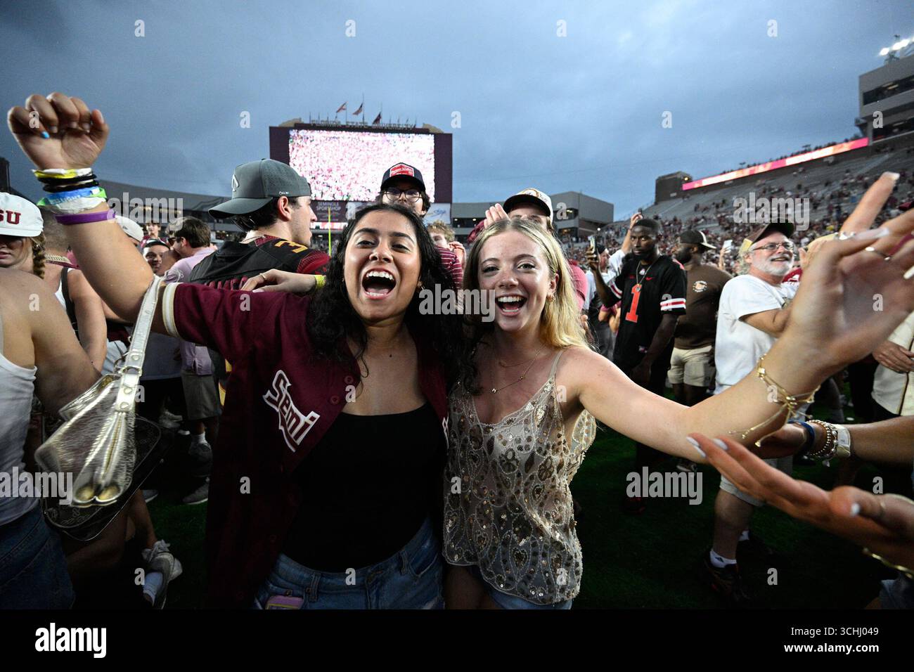 FILE - Florida State fans celebrate on the field after the Seminoles ...