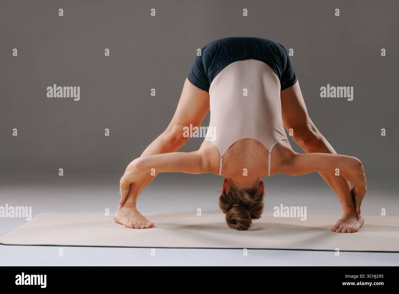 Woman improving flexibility balance hi-res stock photography and images ...