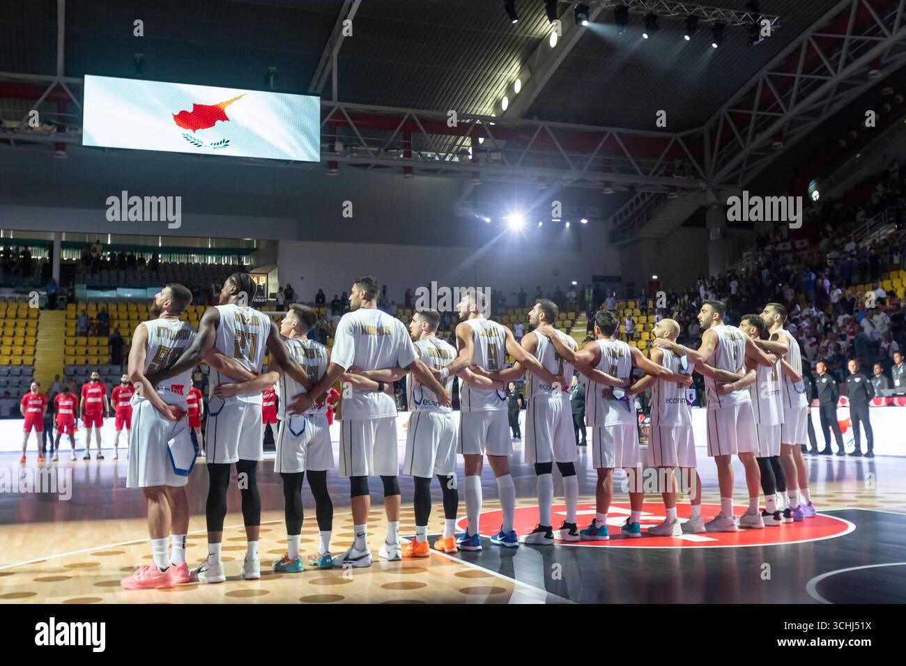 Cyprus players sing the National Anthem before the game. Cyprus and ...
