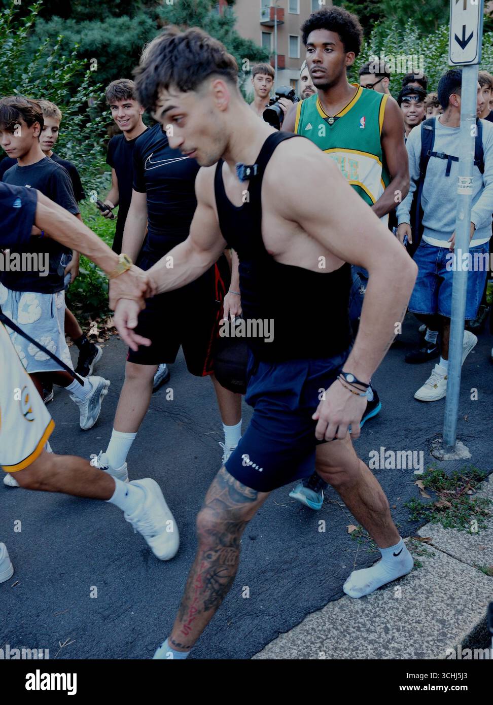 Milan, Matt Kiatipis, basketball player and YouTuber, plays in front of ...