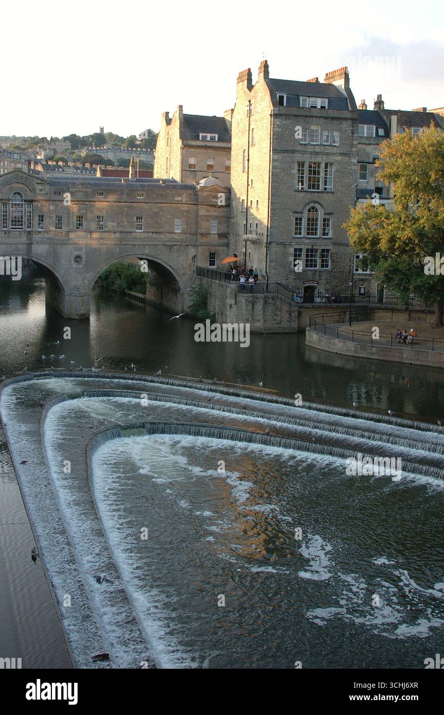 A scenic view of Pulteney Bridge in Bath, England, with the Avon River ...