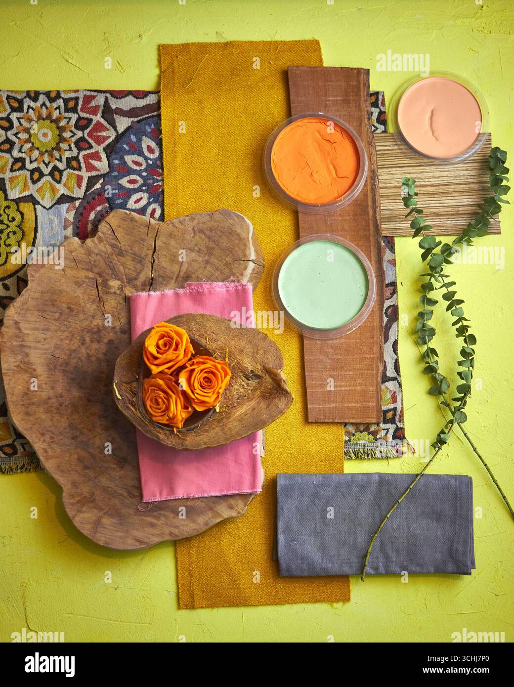 Creative flat lay with natural materials, fabrics, paint samples, and ...
