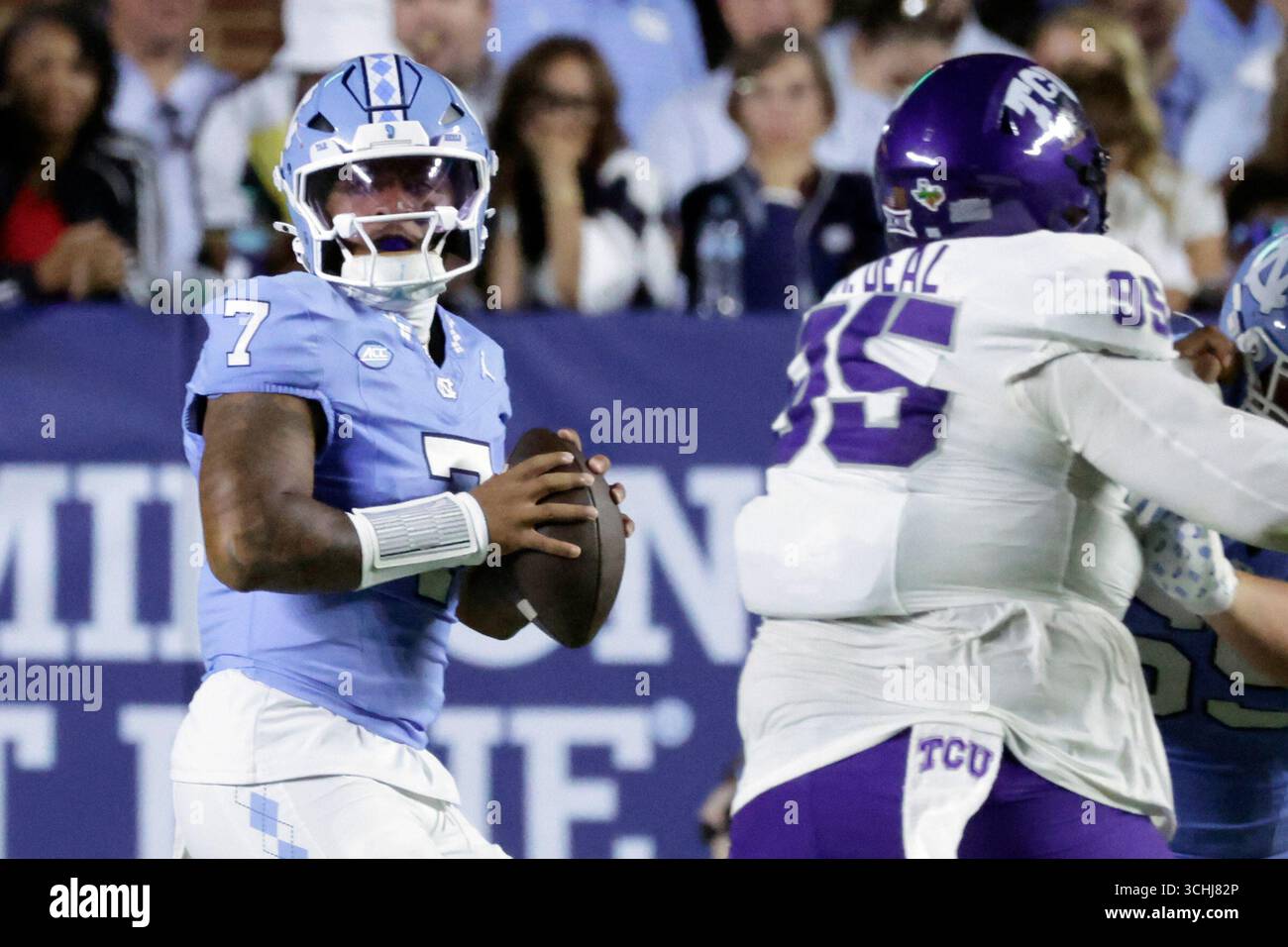 North Carolina quarterback Gio Lopez (7) looks to pass as TCU defensive ...