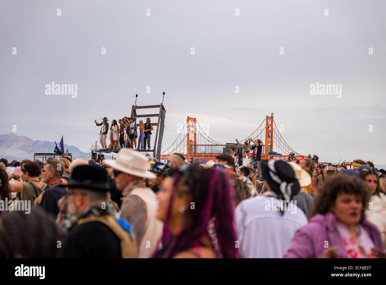 Crowd and Golden Gate Bridge Art Installation at Burning Man 2025 Stock ...