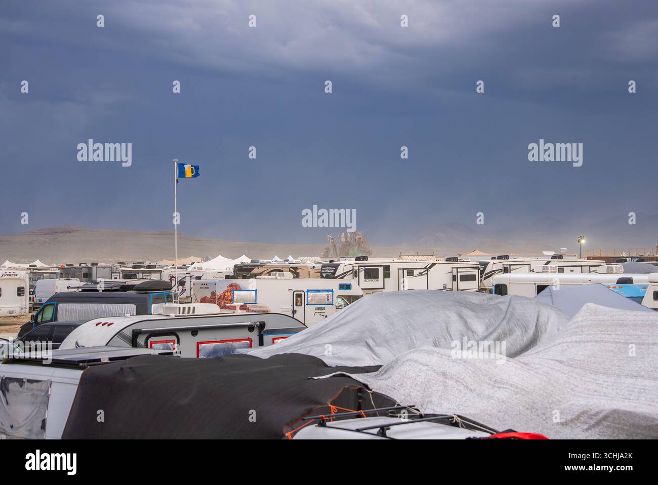 Campsite with RVs, Tents, and Flagpole at Burning Man Festival 2025 ...