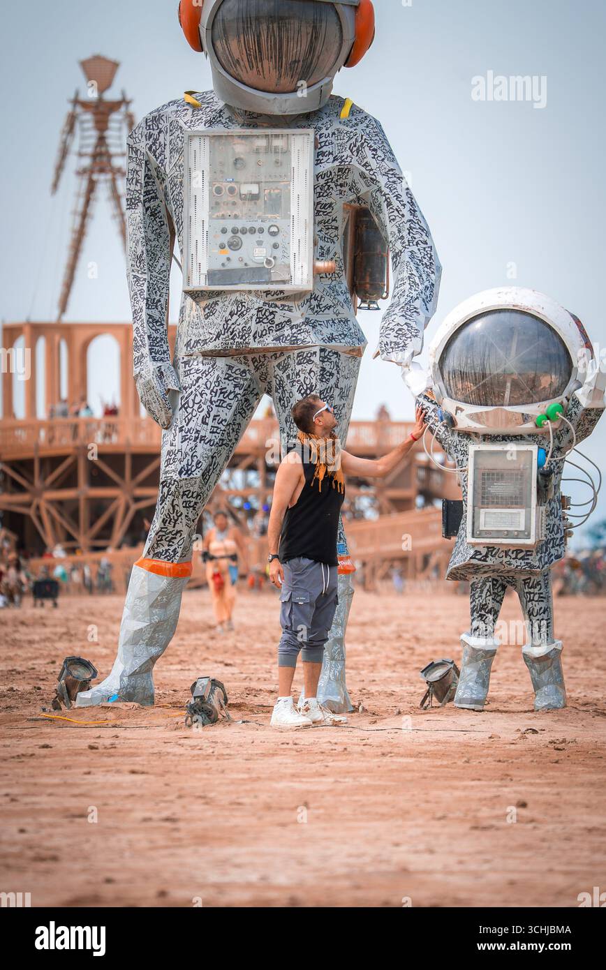 Astronaut Sculptures and Iconic Man Structure at Burning Man 2025 Stock ...