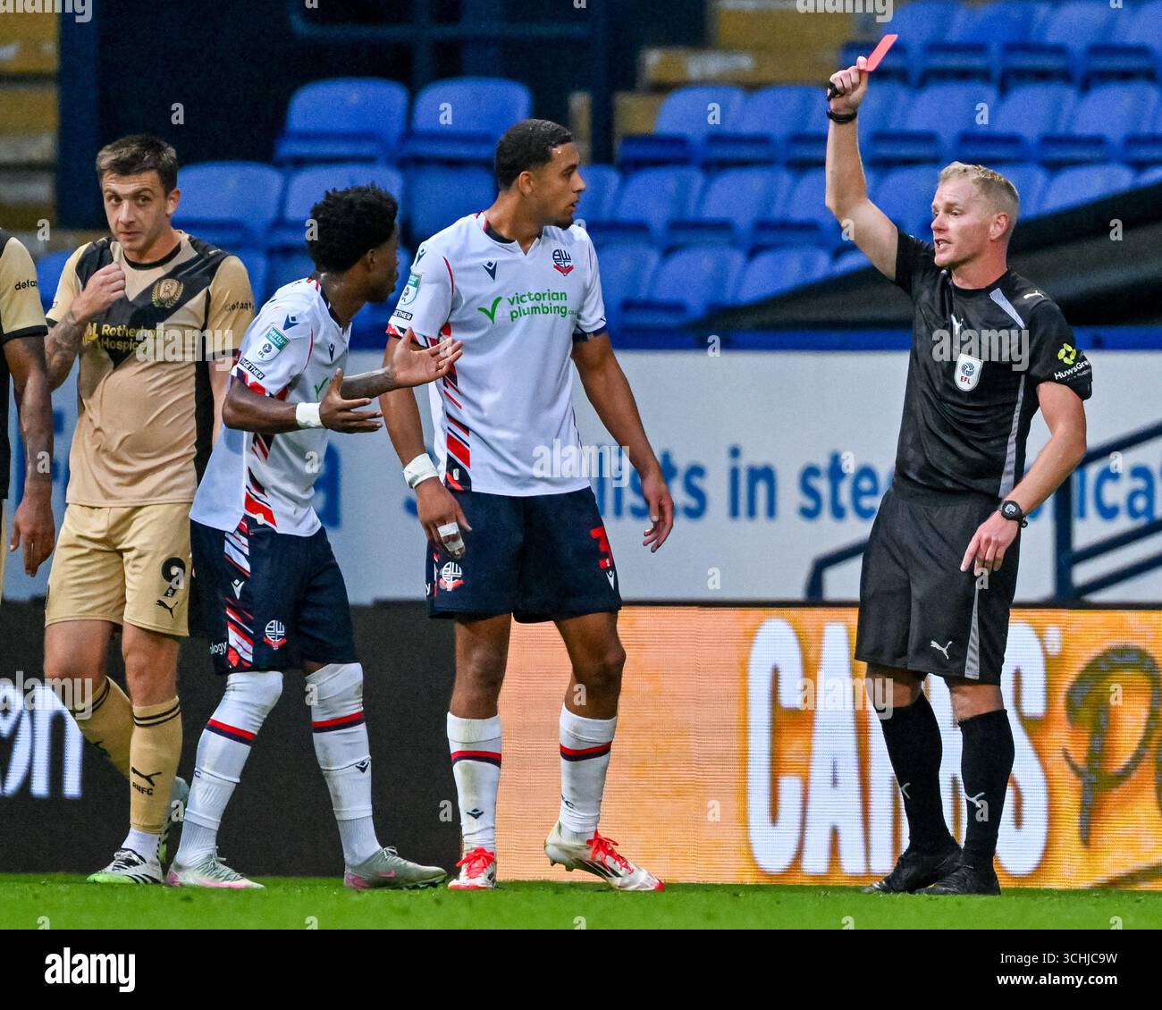Referee Andrew Humphries shows Thierry Gale of Bolton Wanderers a ...