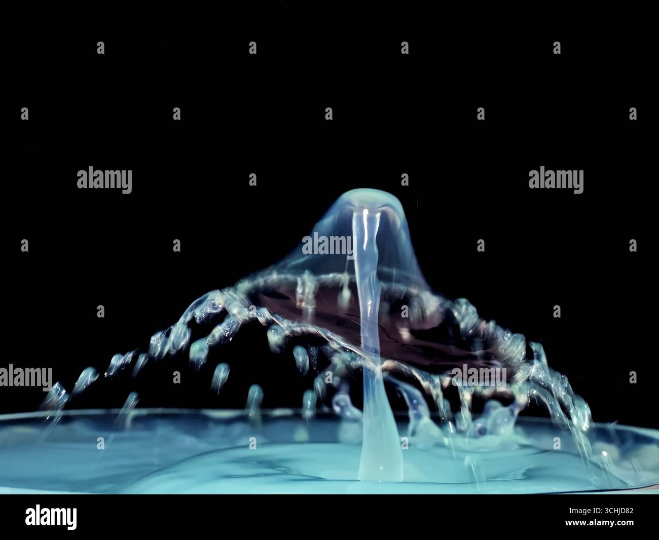Water-drop collision forms an umbrella-like rim with a central rising ...