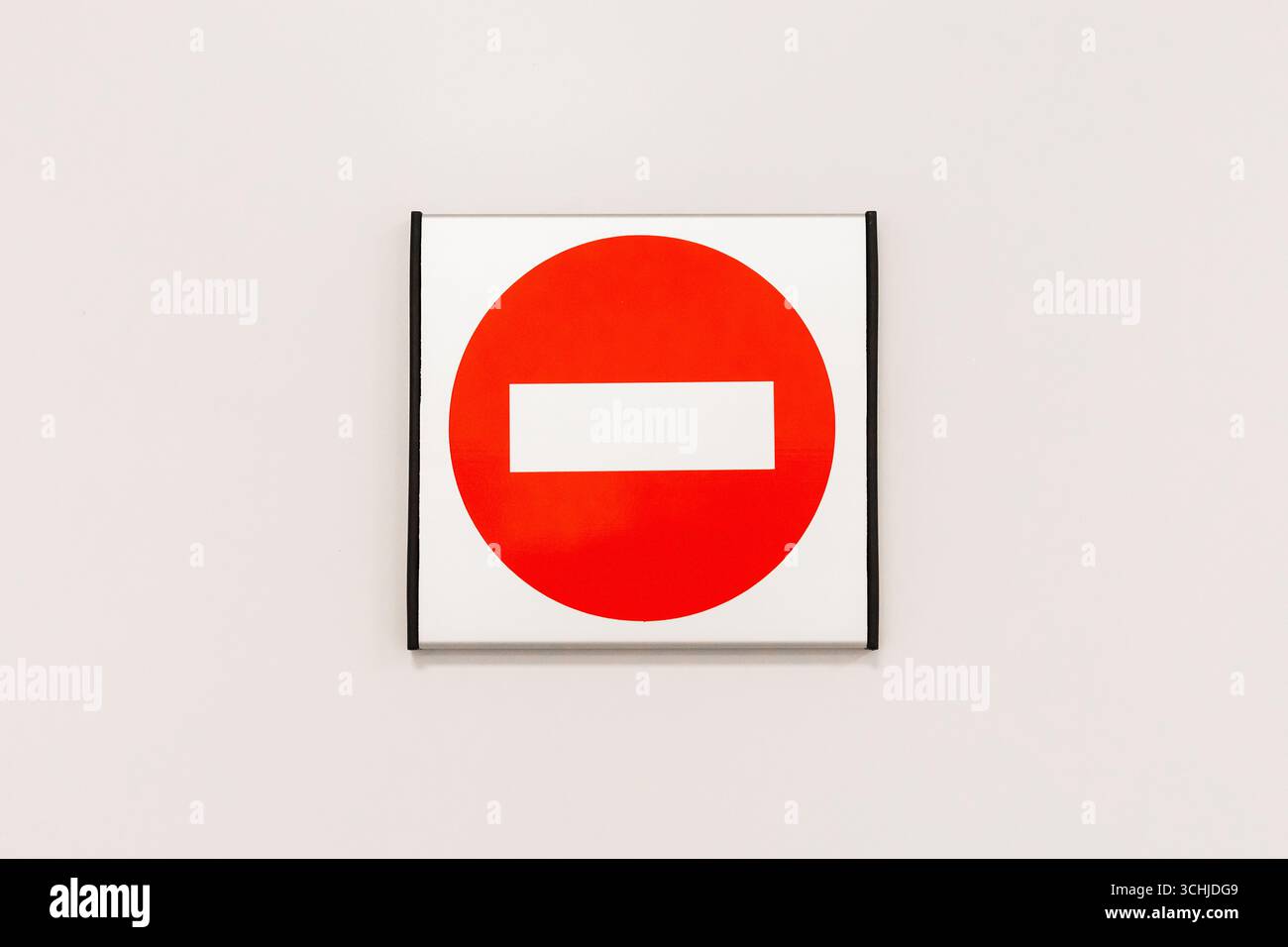 Sign with a bold red circle and white horizontal bar displayed on a ...