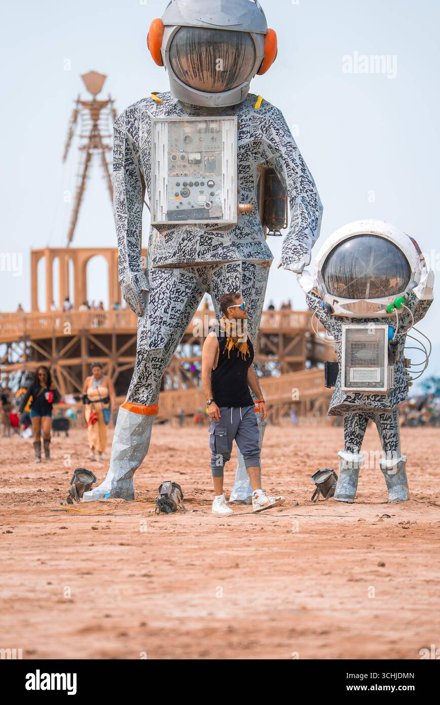 Astronaut Sculptures and Iconic Man Structure at Burning Man 2025 Stock ...