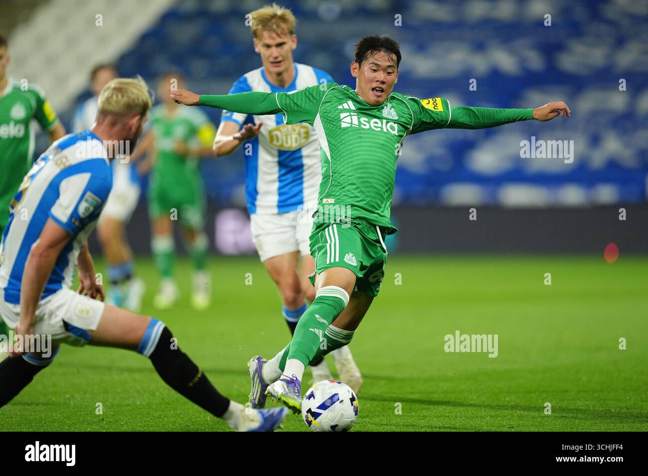 Newcastle United's Park Seung Soo (right) and Hudderfield Town's Jack ...