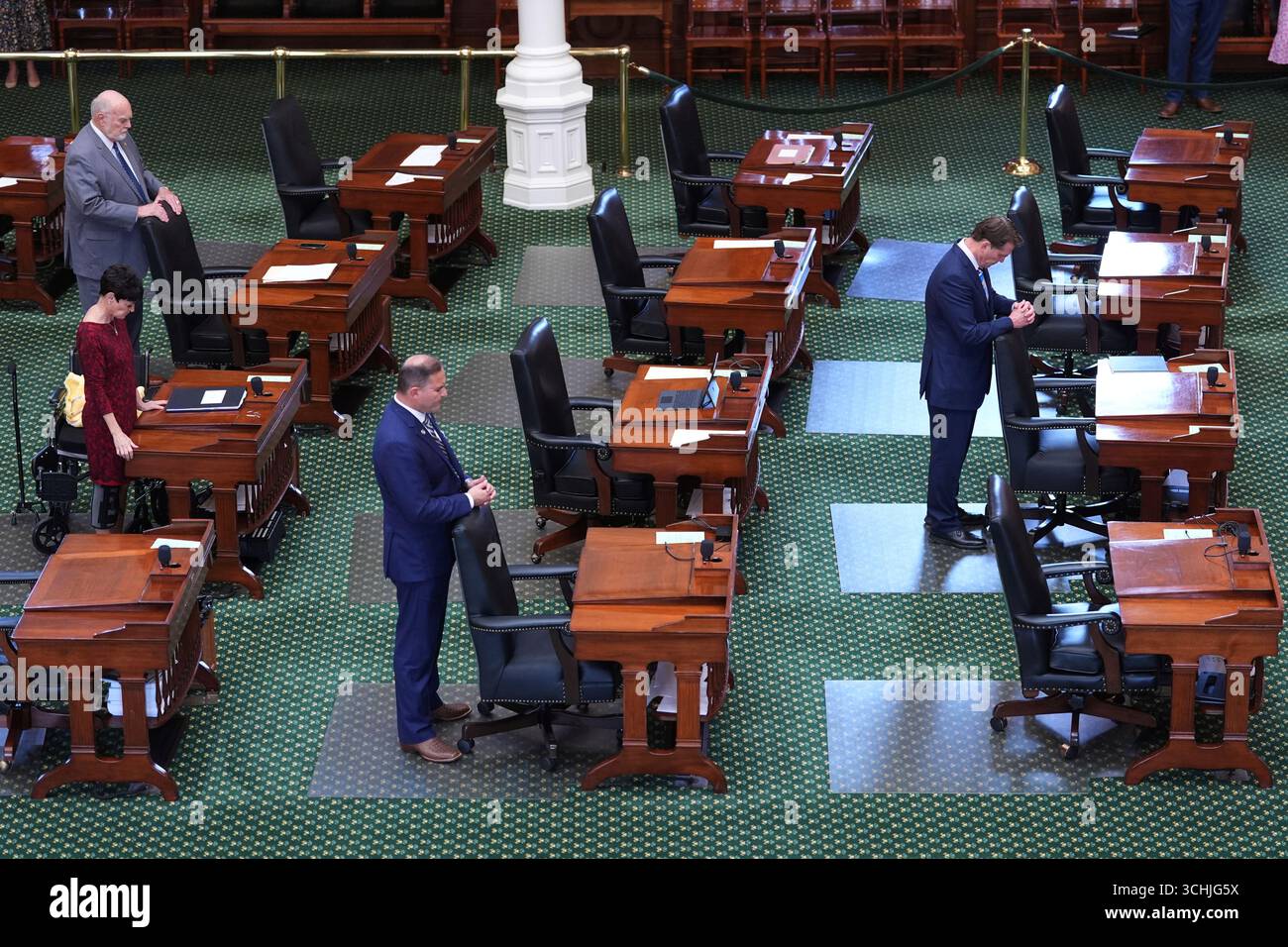 Members of the Texas Senate pray as they continue their special session ...