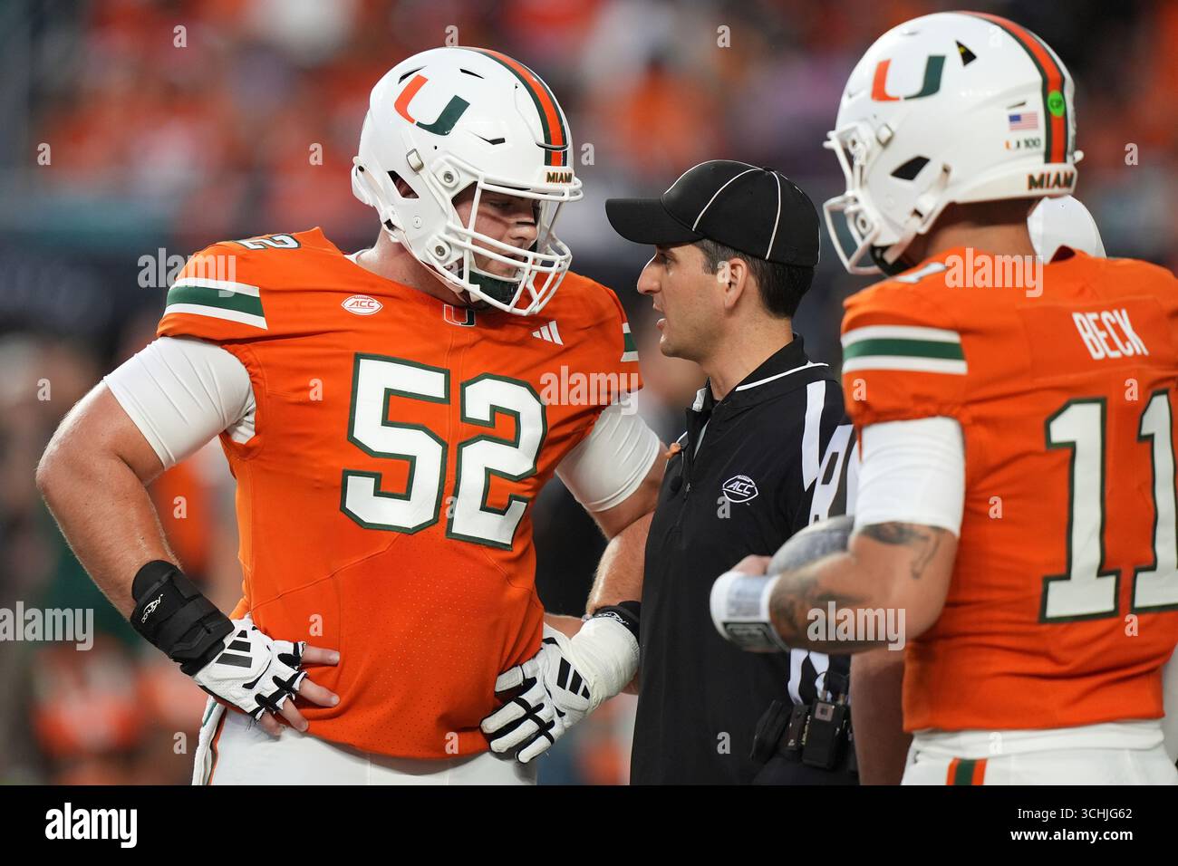 Miami center James Brockermeyer (52) and quarterback Carson Beck (11 ...