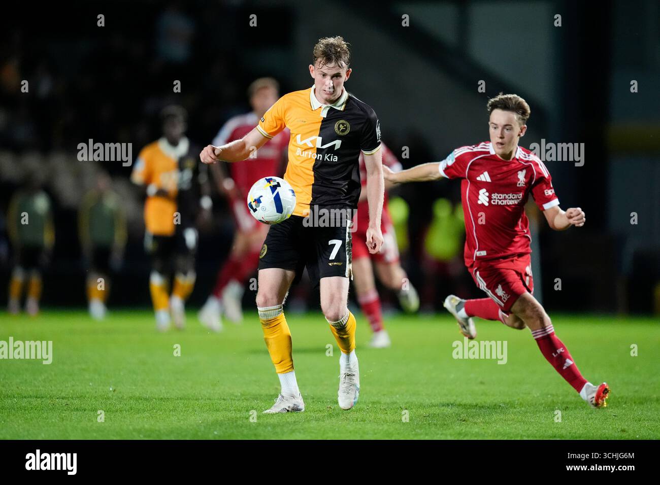 Burton Alboin's JJ McKiernan (centre) and Liverpool's Tommy Pilling ...