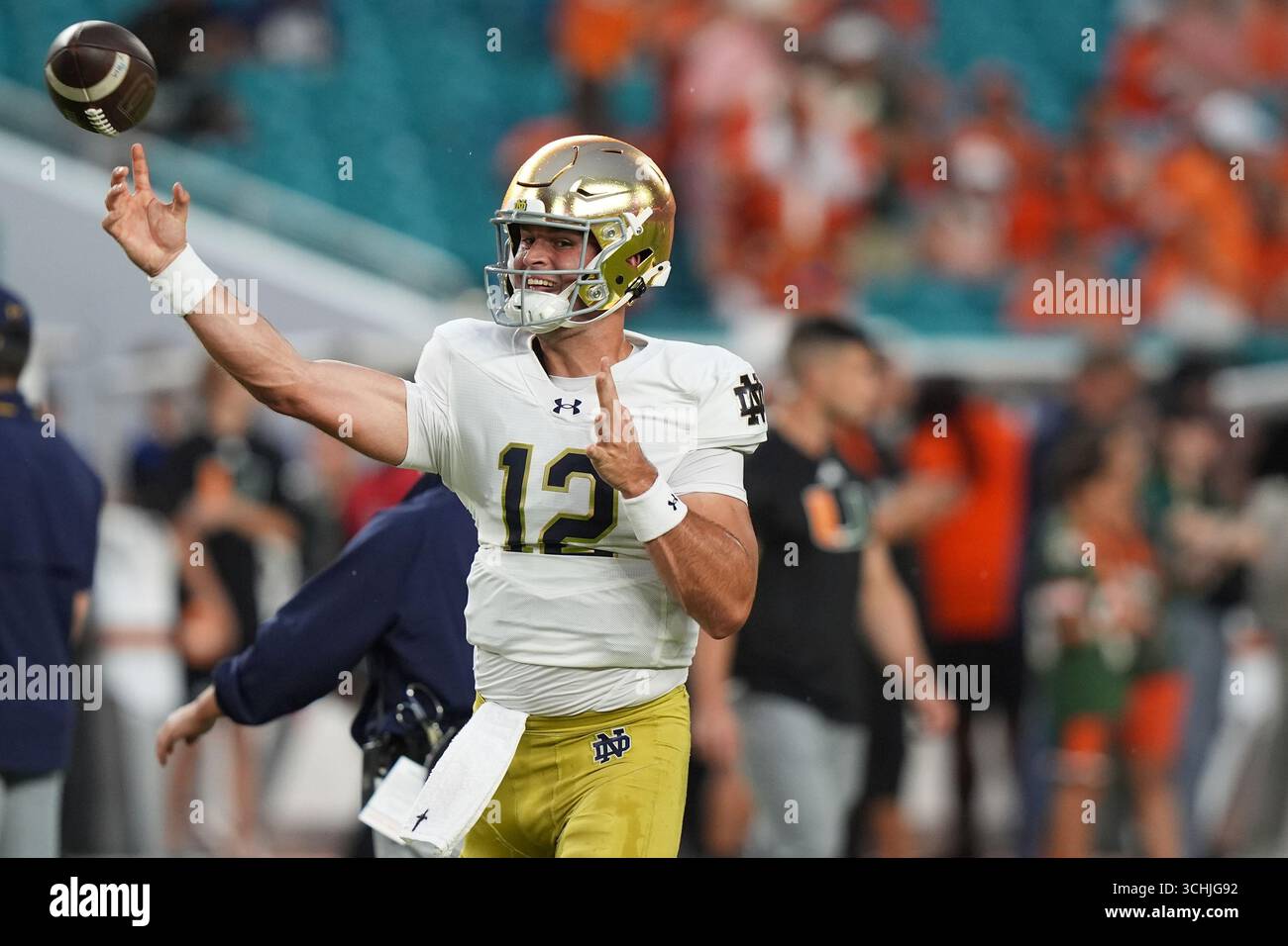 Notre Dame quarterback Blake Hebert (12) warms up before an NCAA ...