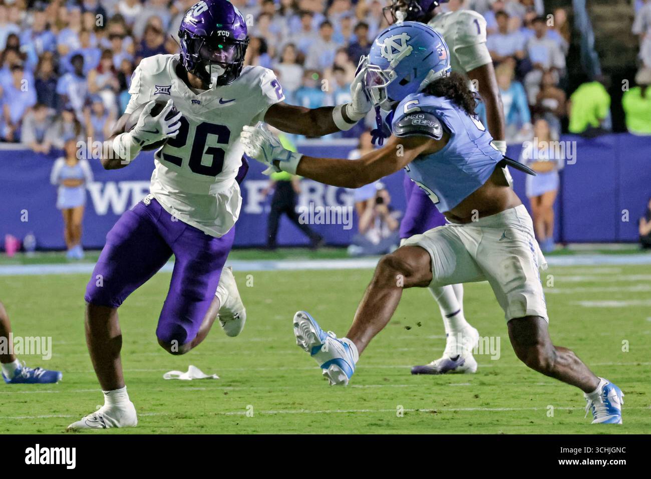 TCU running back Jeremy Payne (26) tries to avoid a tackle by North ...
