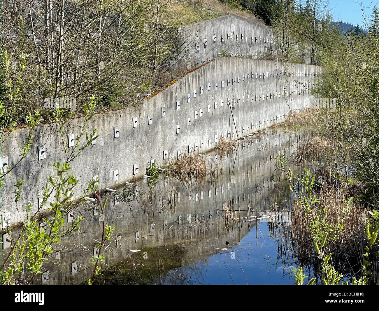 Stormwater retention pond and retaining wall in a suburban community ...