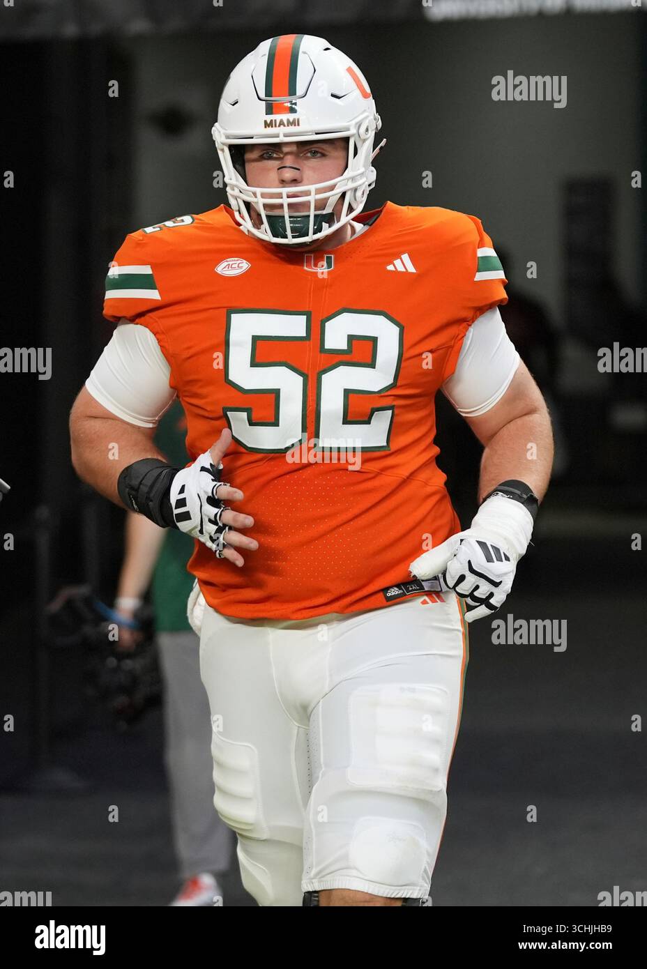 Miami offensive lineman James Brockermeyer (52) runs onto the field ...