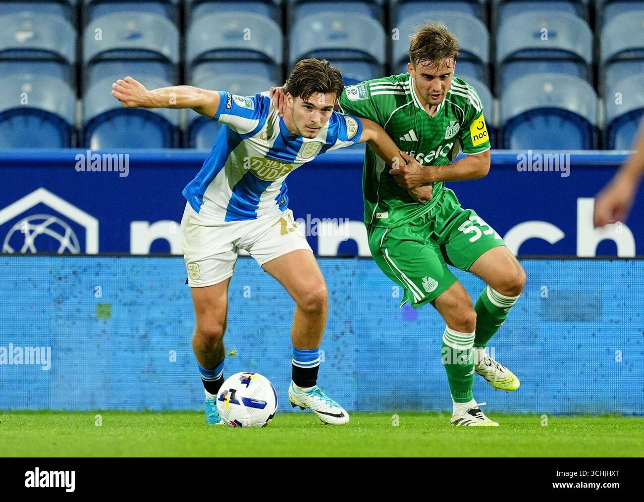 Hudderfield Town's Leo Castledine (left) and Newcastle United's Fraser ...