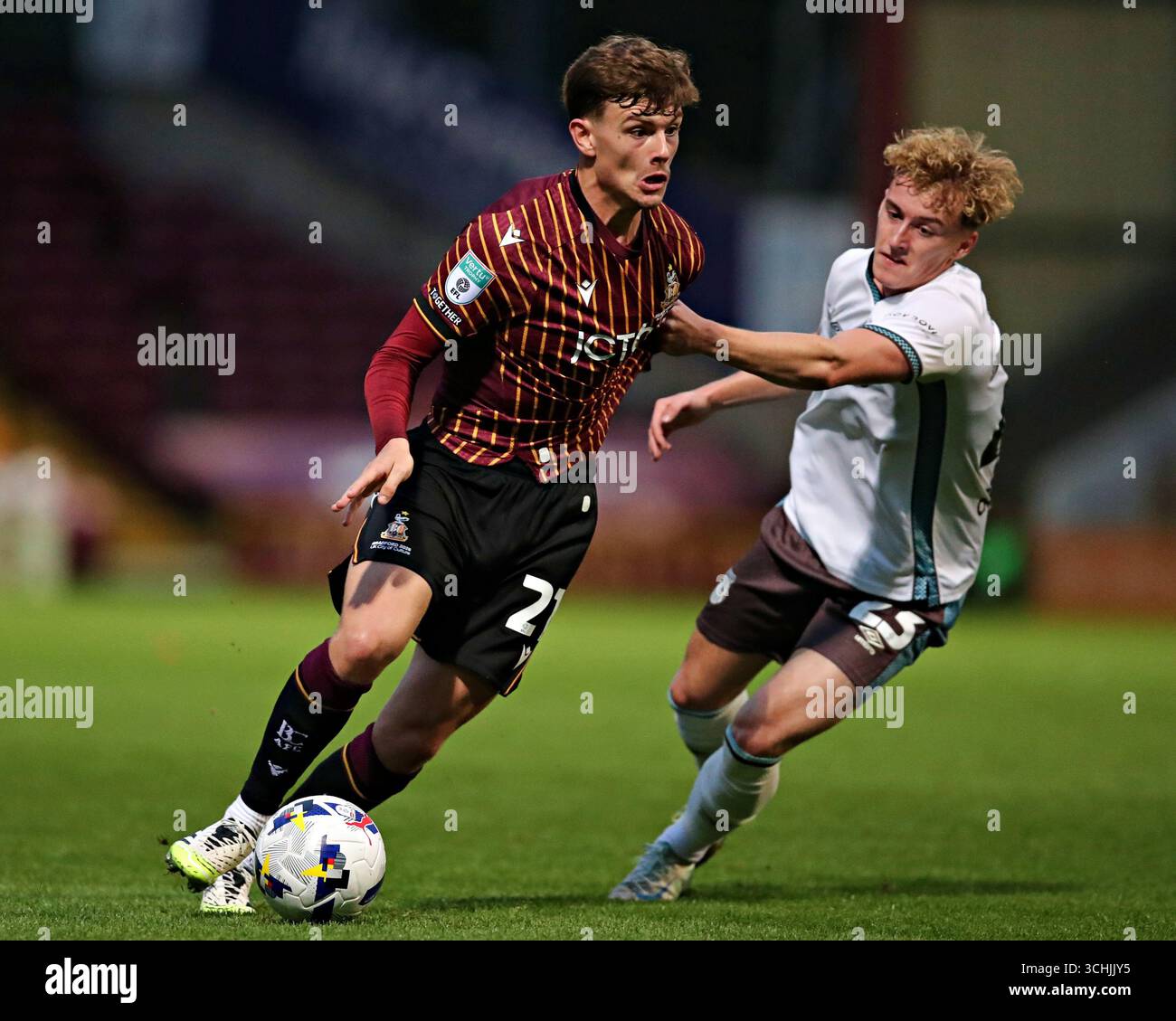 Henry Brown of Grimsby Town pressures Jenson Metcalfe of Bradford City ...