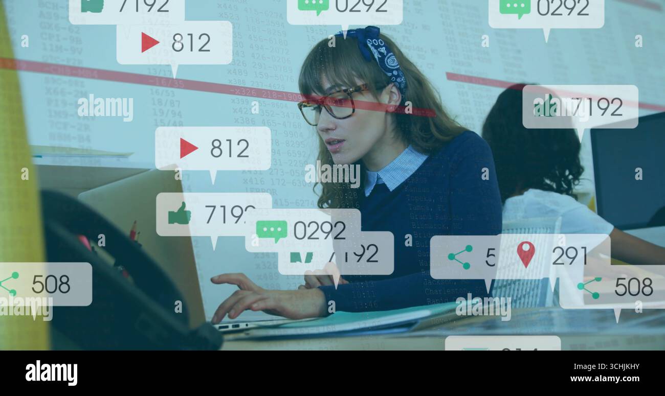Analyzing professional reviewing laptop data at office desk ...