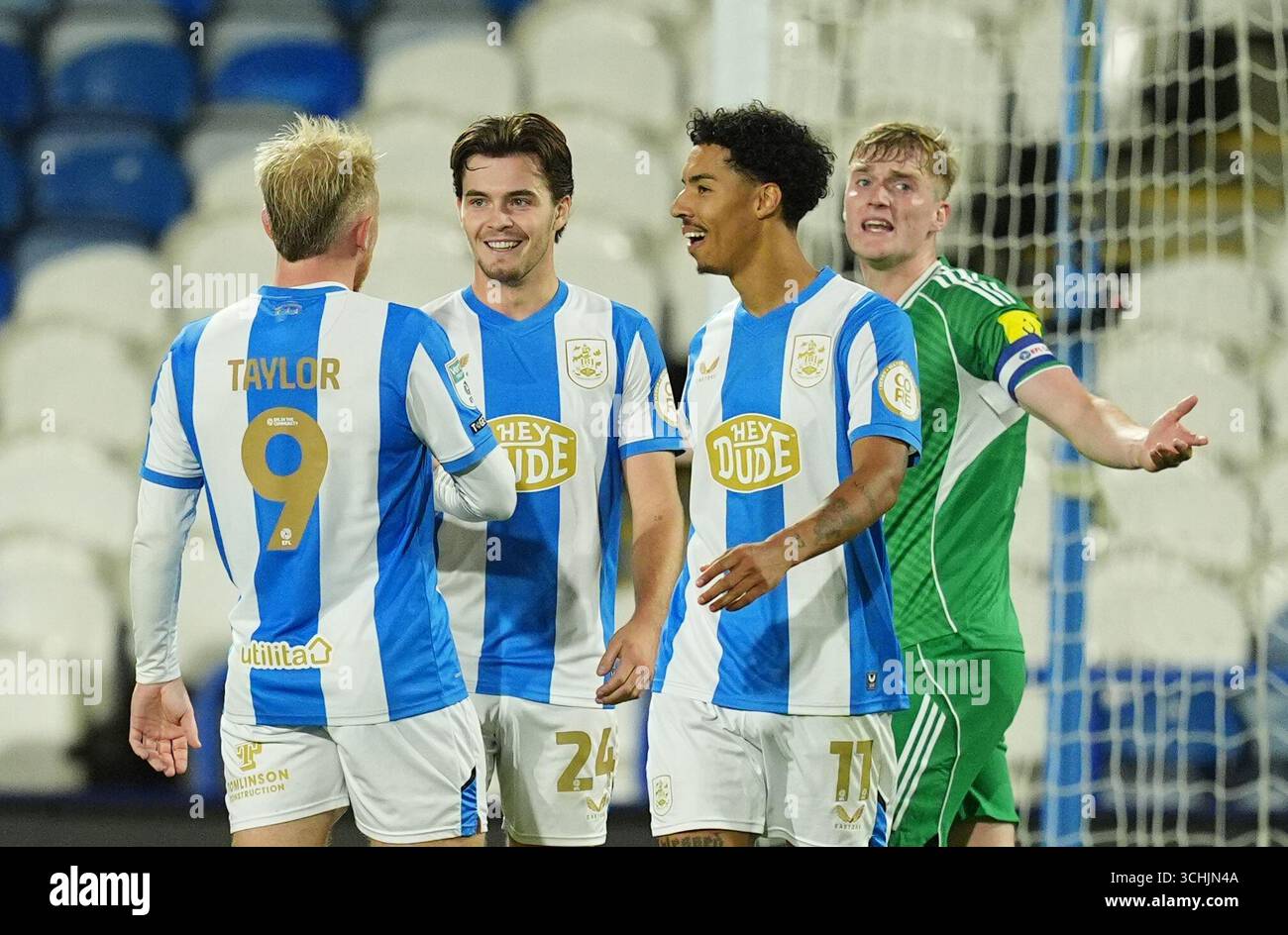 Hudderfield Town's Leo Castledine celebrates scoring their side's third ...