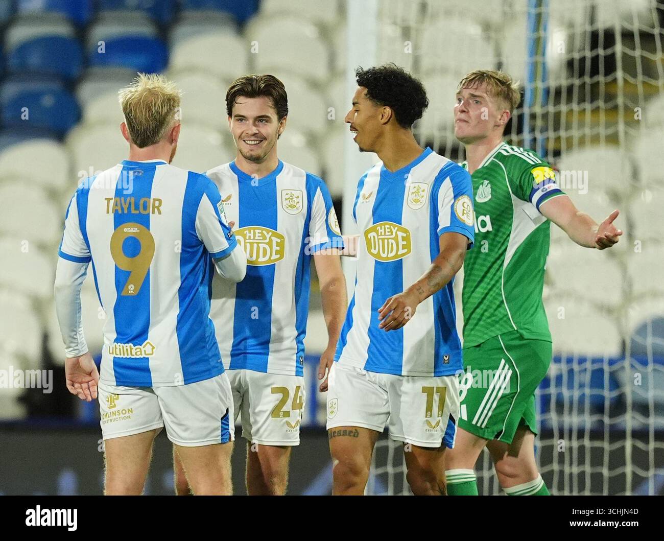 Hudderfield Town's Leo Castledine celebrates scoring their side's third ...