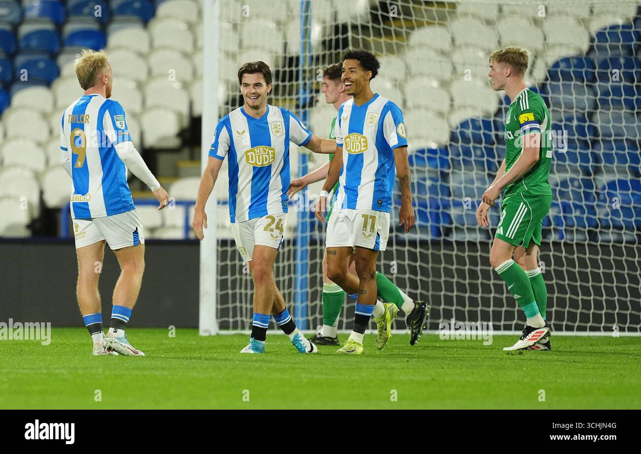 Hudderfield Town's Leo Castledine celebrates scoring their side's third ...