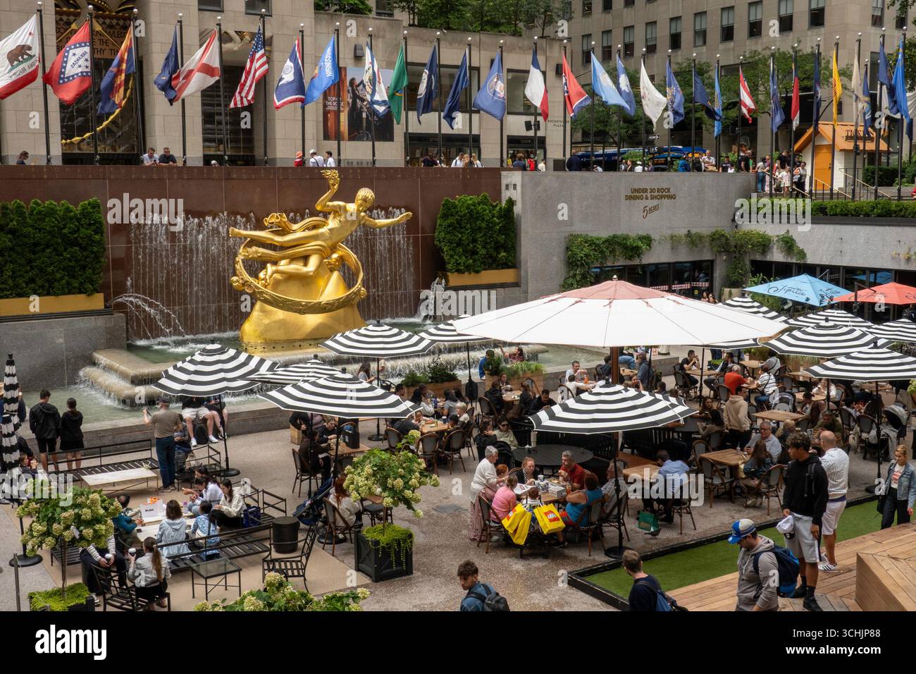 Statue of Prometheus and Outdoor Dining at Rockefeller Center Plaza ...