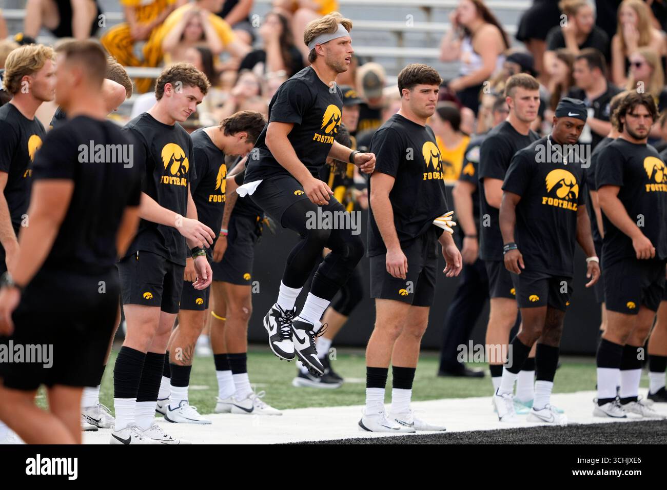 Iowa quarterback Mark Gronowski, center, warms up before an NCAA ...