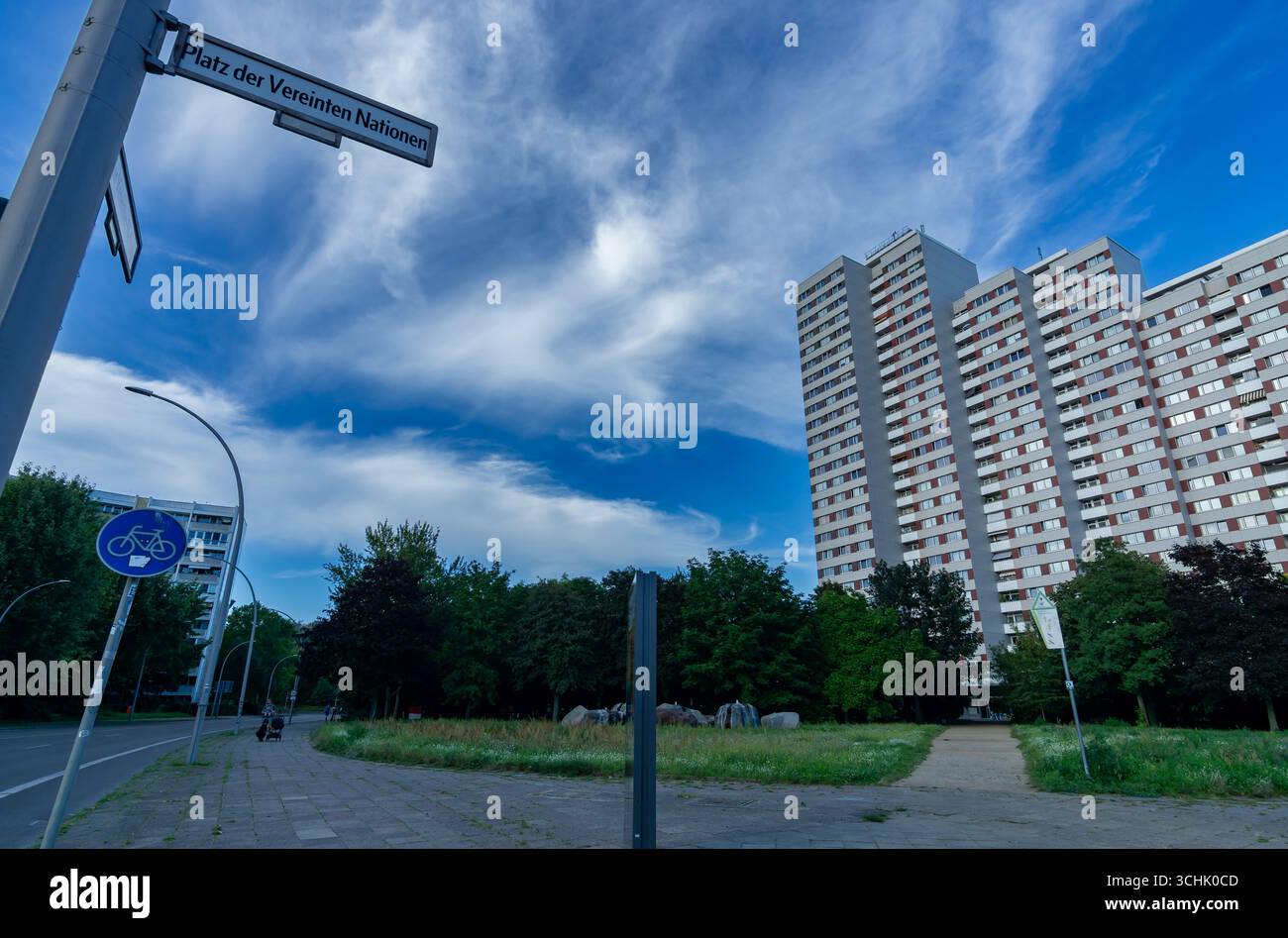 Street sign of Platz der Vereinten Nationen with modernist high-rise ...
