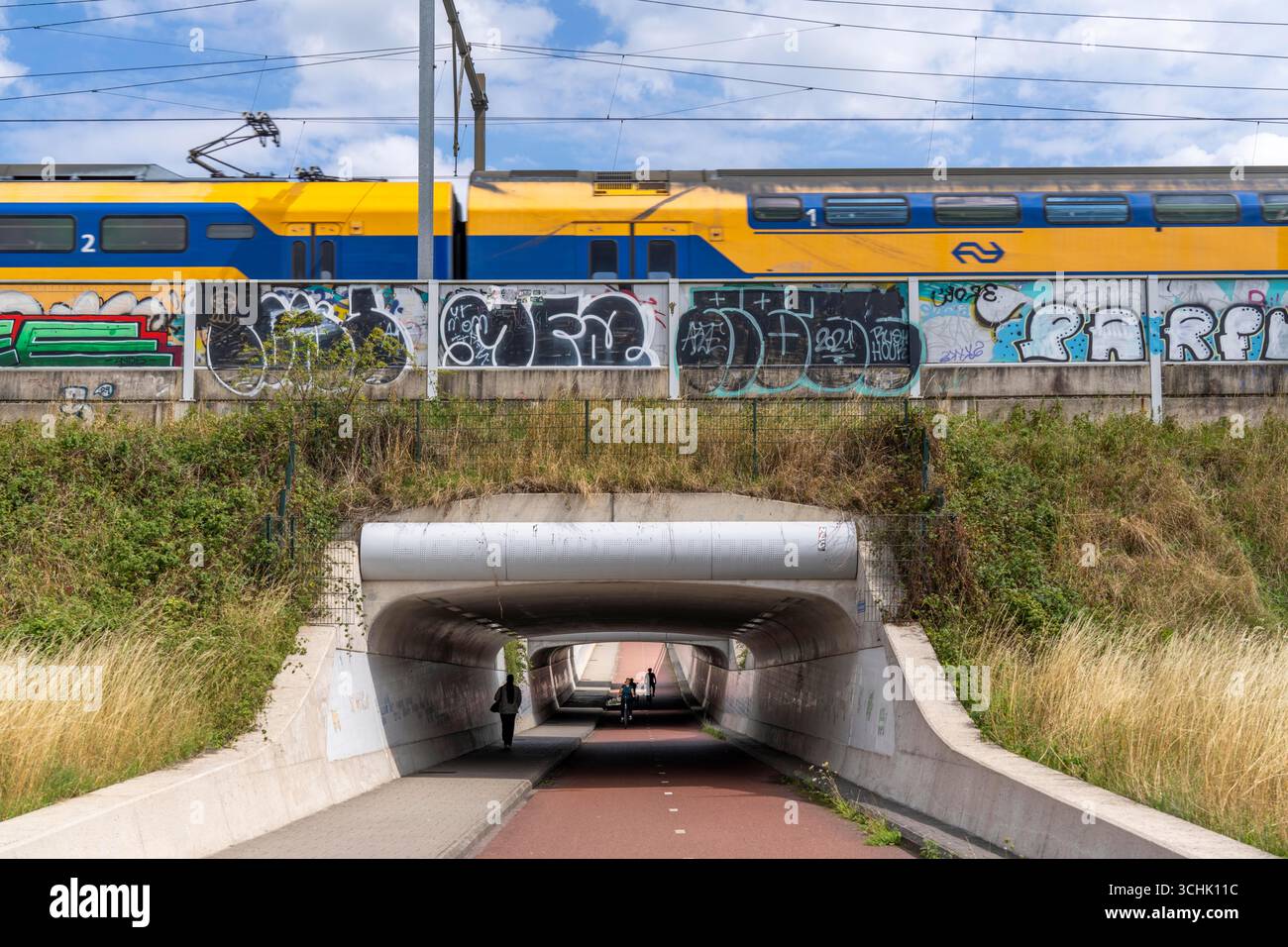 Cycle path in the north of Nijmegen, railway underpass, wide cycle path ...