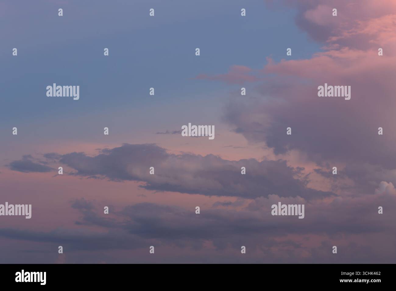 A breathtaking view of a sunset sky featuring soft pastel colors and ...