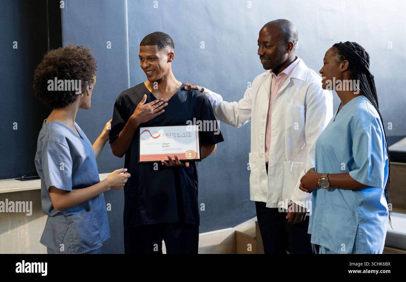 Diverse medical colleagues celebrating in hi-res stock photography and ...
