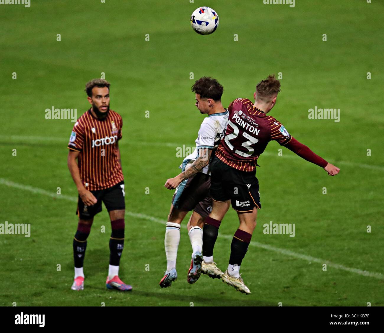 Bobby Pointon of Bradford City battles with George McEachran of Grimsby ...