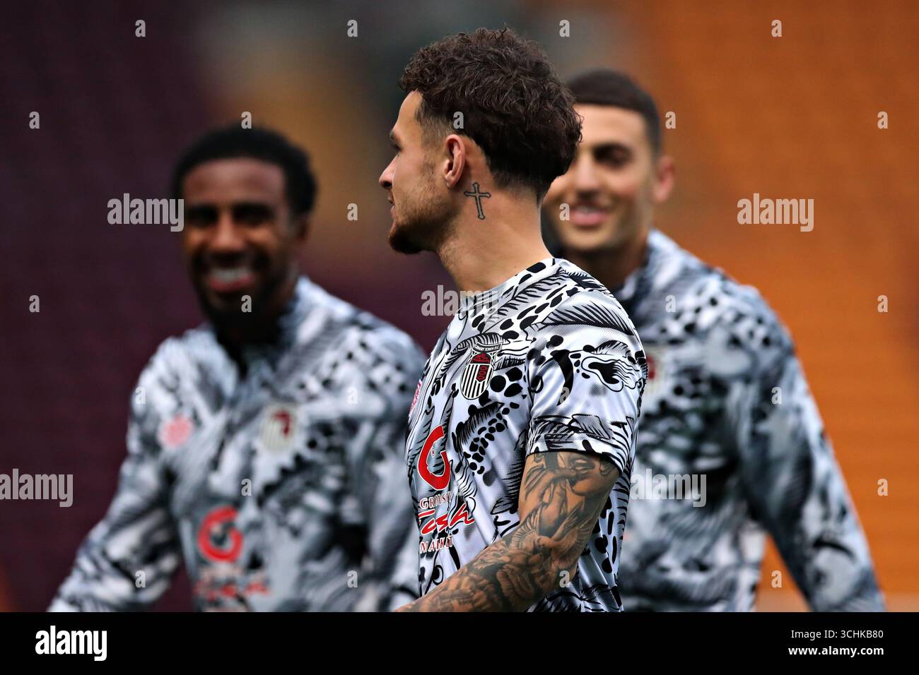 A Cross tattoo on the neck of George McEachran of Grimsby Town during ...
