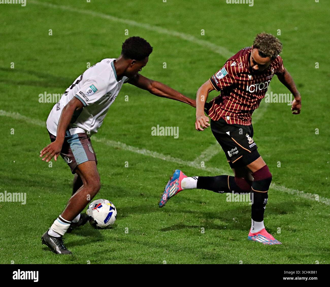 Fortune Onoh of Grimsby Town pressures Tyreik Wright of Bradford City during The Vertu Trophy ...