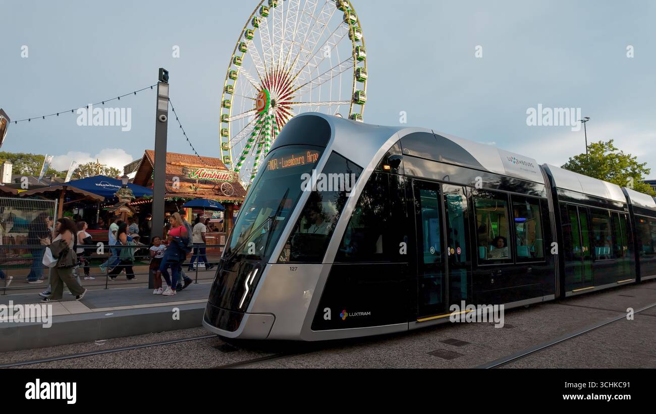 LUXEMBURG, EUROPE - SEPTEMBER 1, 2025 - Modern tram passing by the ...