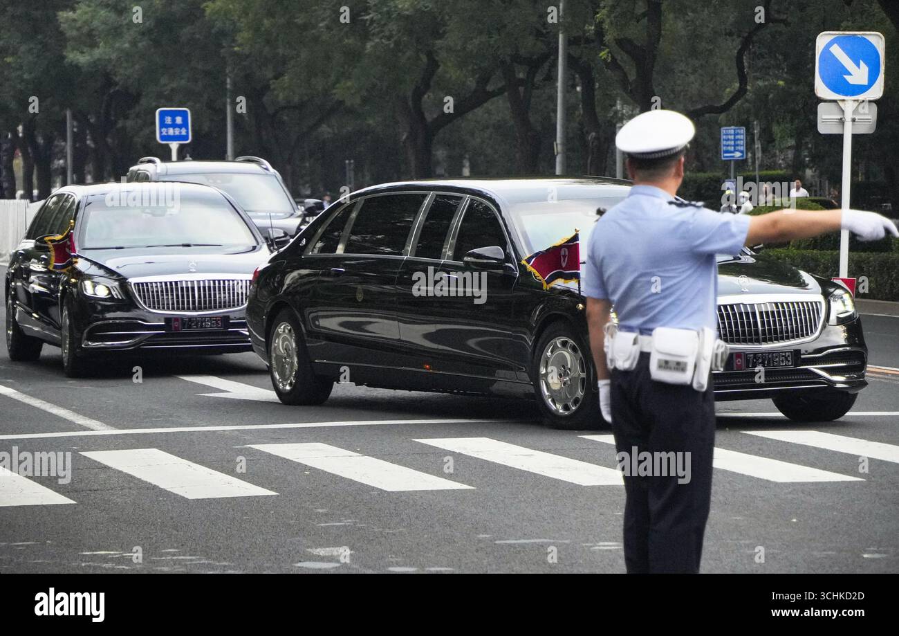 A motorcade with North Korean national flags is seen in Beijing on Sept ...